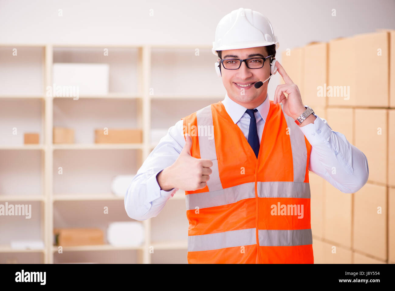 Man working in postal parcel delivery service office Stock Photo - Alamy
