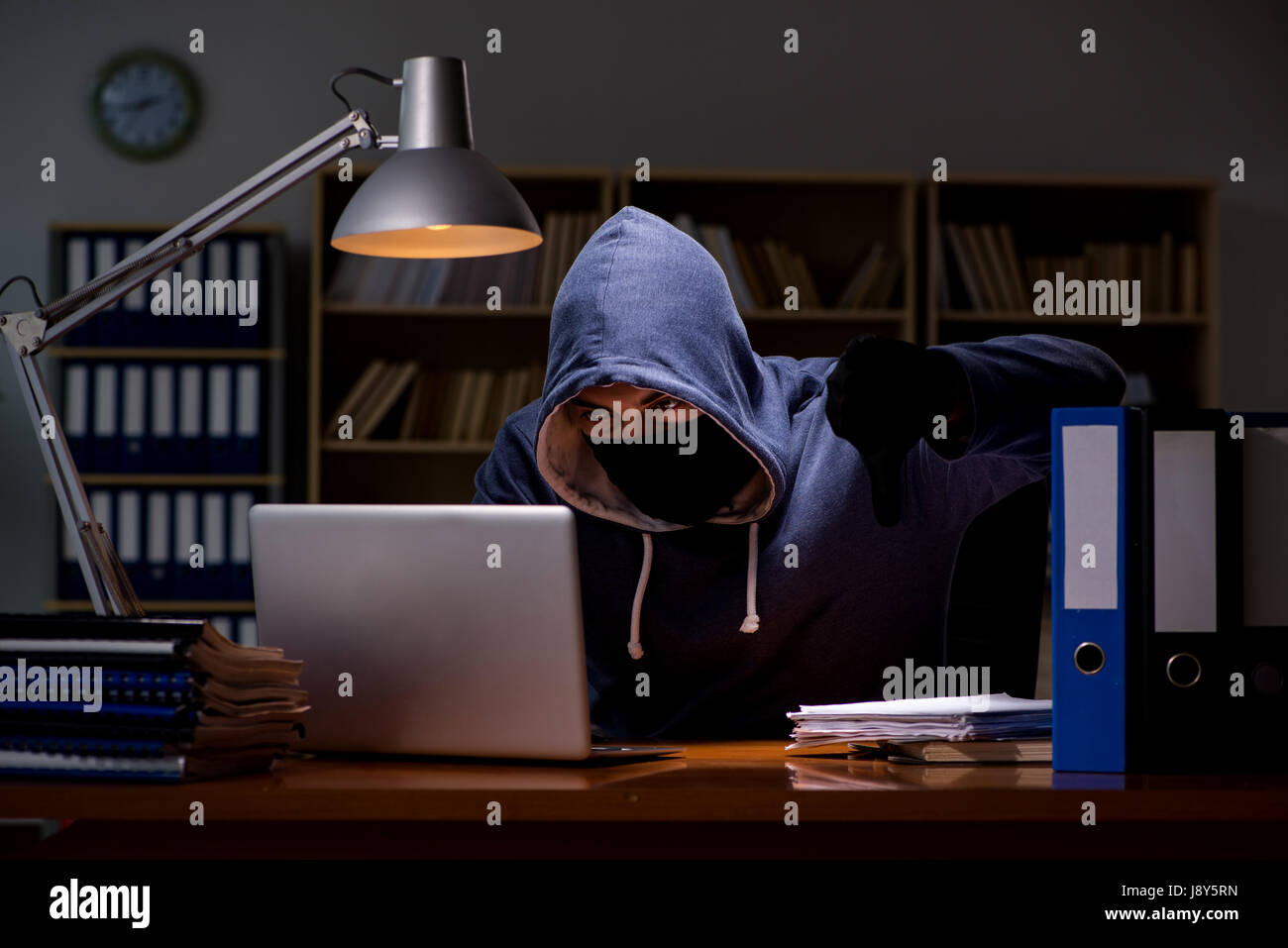 Hacker stealing personal data from home computer Stock Photo - Alamy