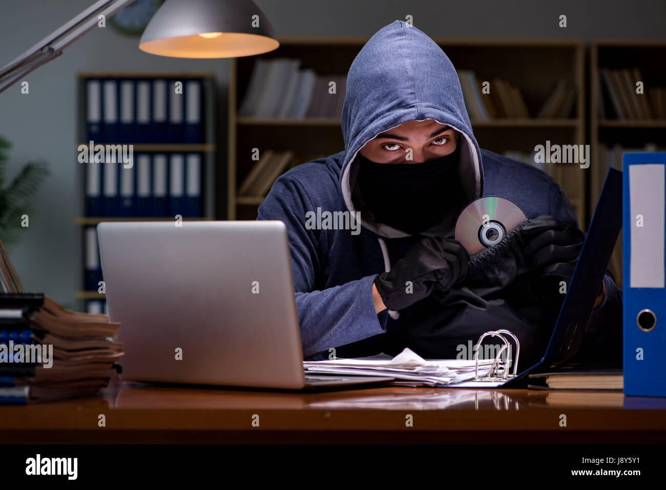 Hacker stealing personal data from home computer Stock Photo - Alamy