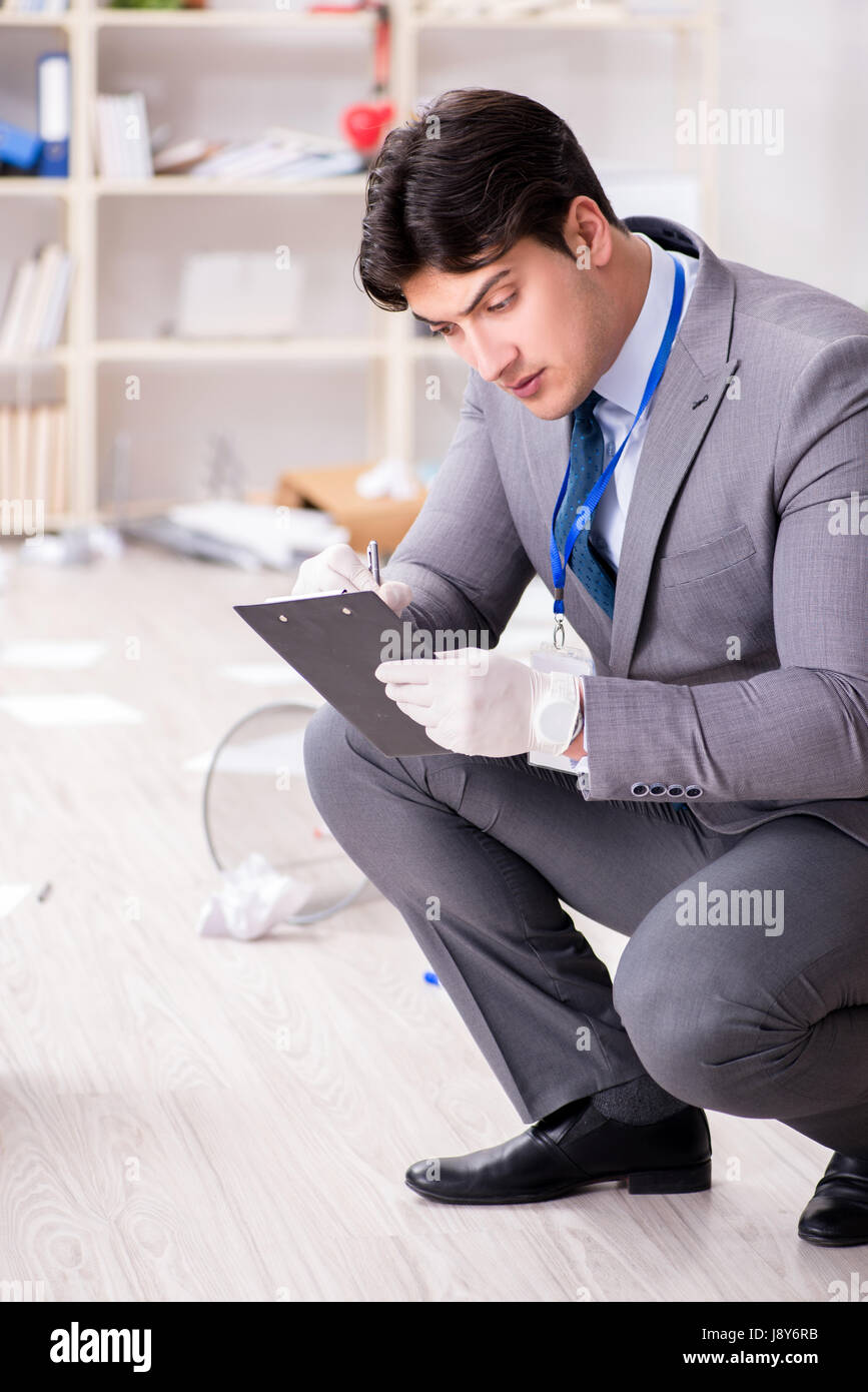 Young man during crime investigation in office Stock Photo - Alamy