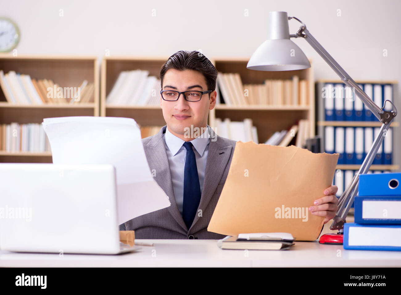 Businessman receiving letter in the office Stock Photo - Alamy
