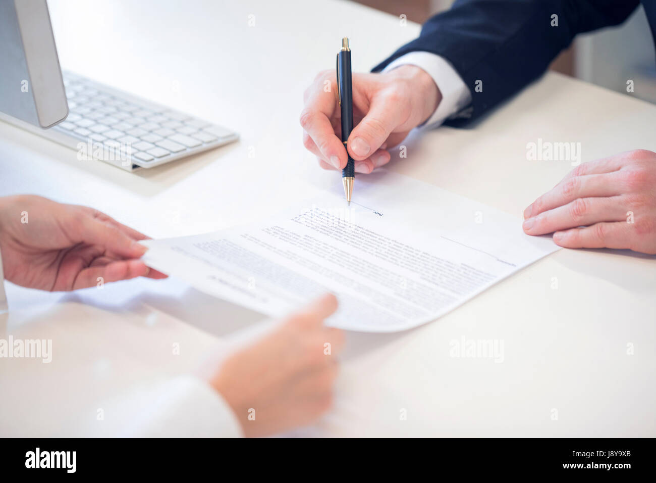Human hands working with documents, signing contract at the desk ...