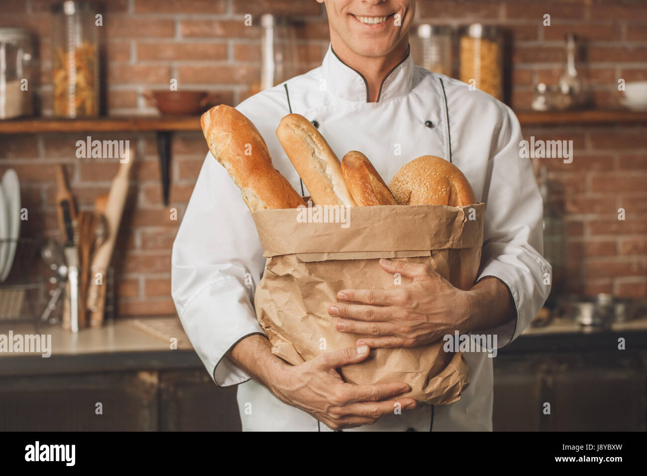 Bakery chef cooking bake in the kitchen professional Stock Photo - Alamy
