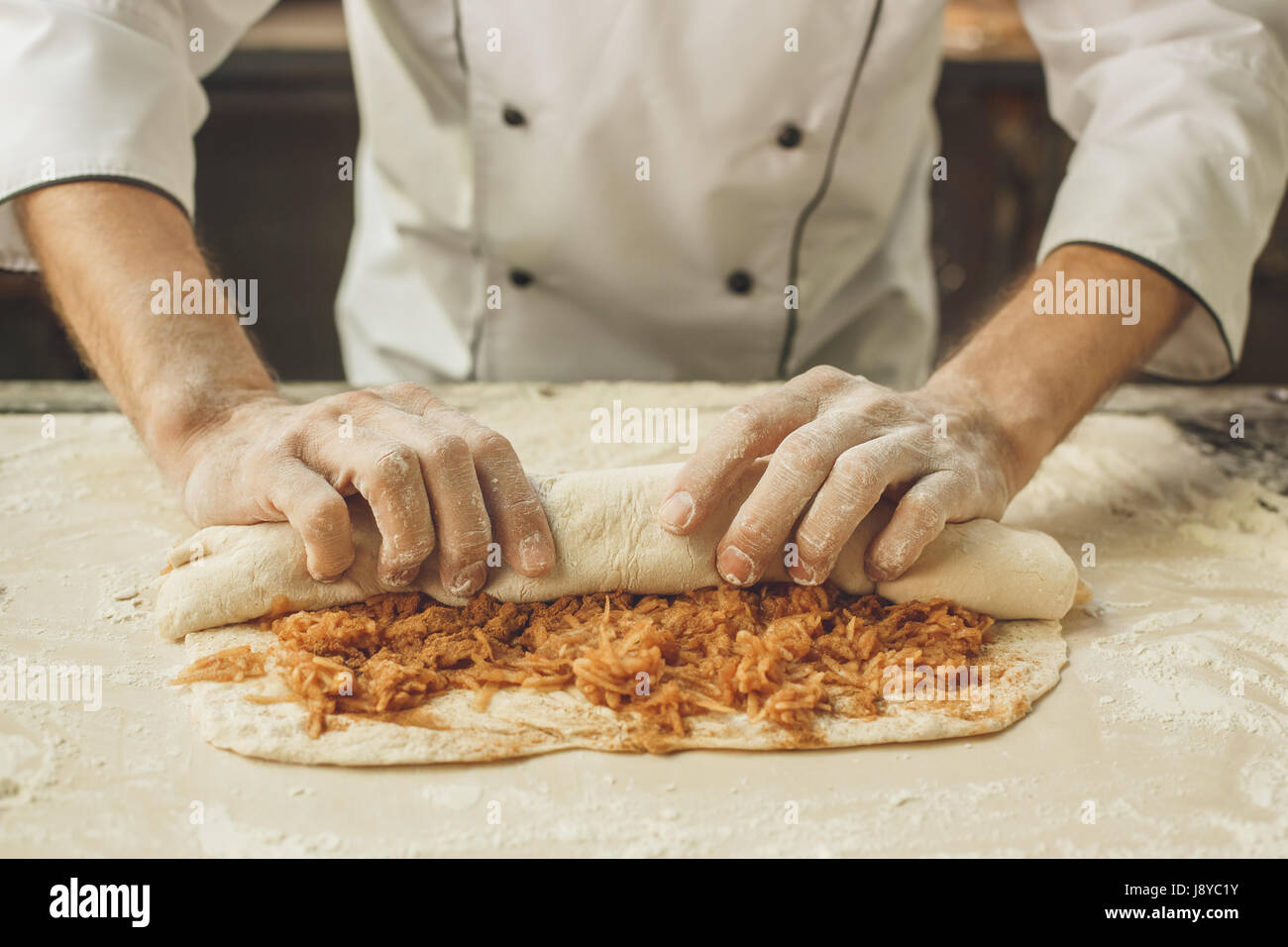 Bakery chef cooking bake in the kitchen professional Stock Photo - Alamy