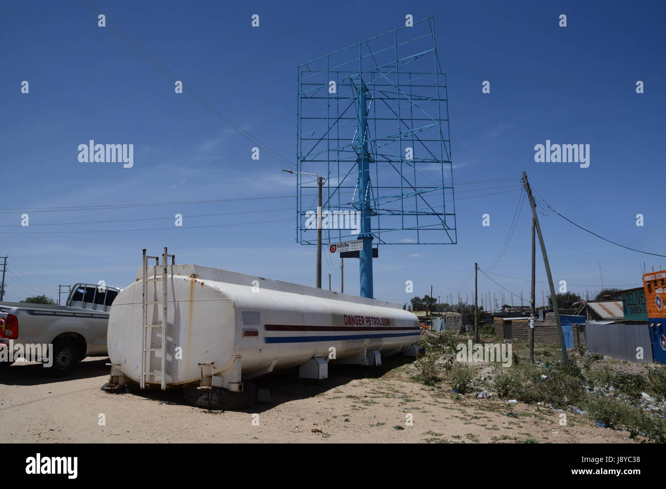 Discarded oil tanker, & empty billboard, Kenya Stock Photo - Alamy