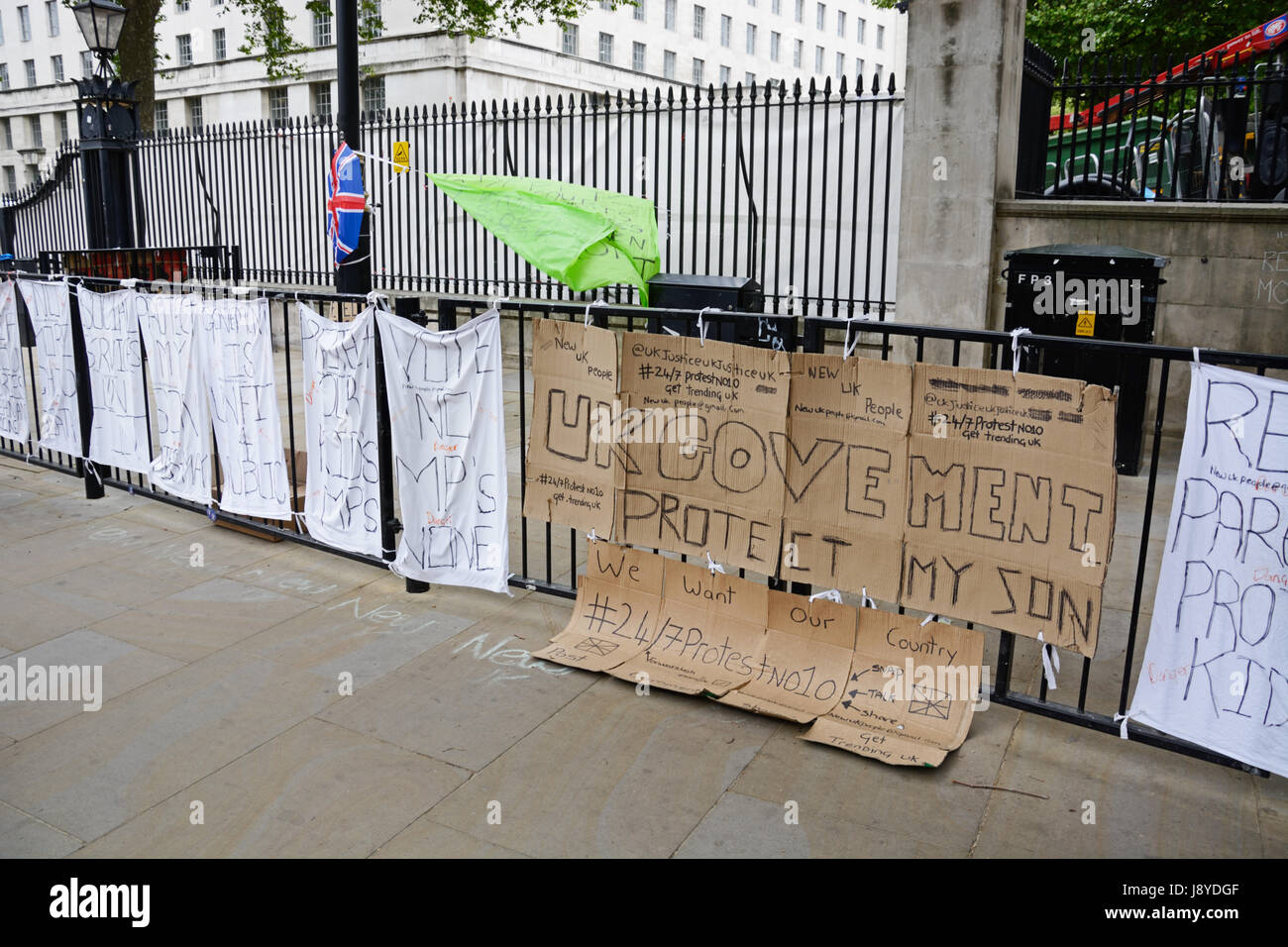Protest posters on Whitehall, opposite Downing Street, London Stock ...