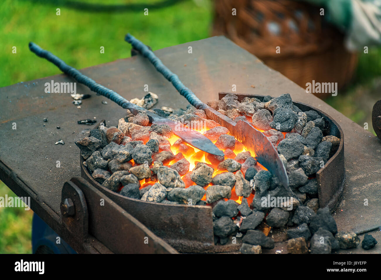 Blacksmith, smithy and blacksmith tools - Folk art Stock Photo - Alamy