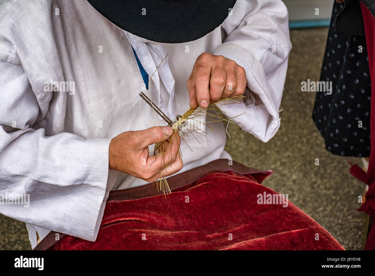 Traditional tinker (Drotar) making a bowl from wire - Folk art Stock ...