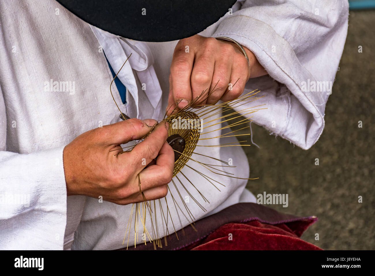 Traditional tinker (Drotar) making a bowl from wire - Folk art Stock ...