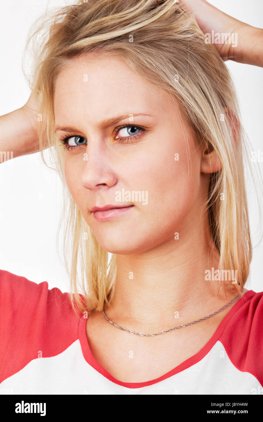 young blonde woman with hands in hair Stock Photo - Alamy