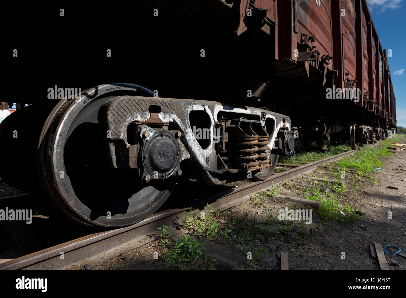 Close-up Steel diesel railcar train bogie wheels on the tracks Stock ...