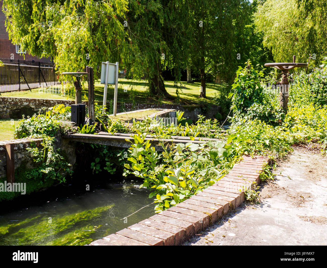 In the centre of Winchester, Hampshire the River Itchen below Town Mill ...