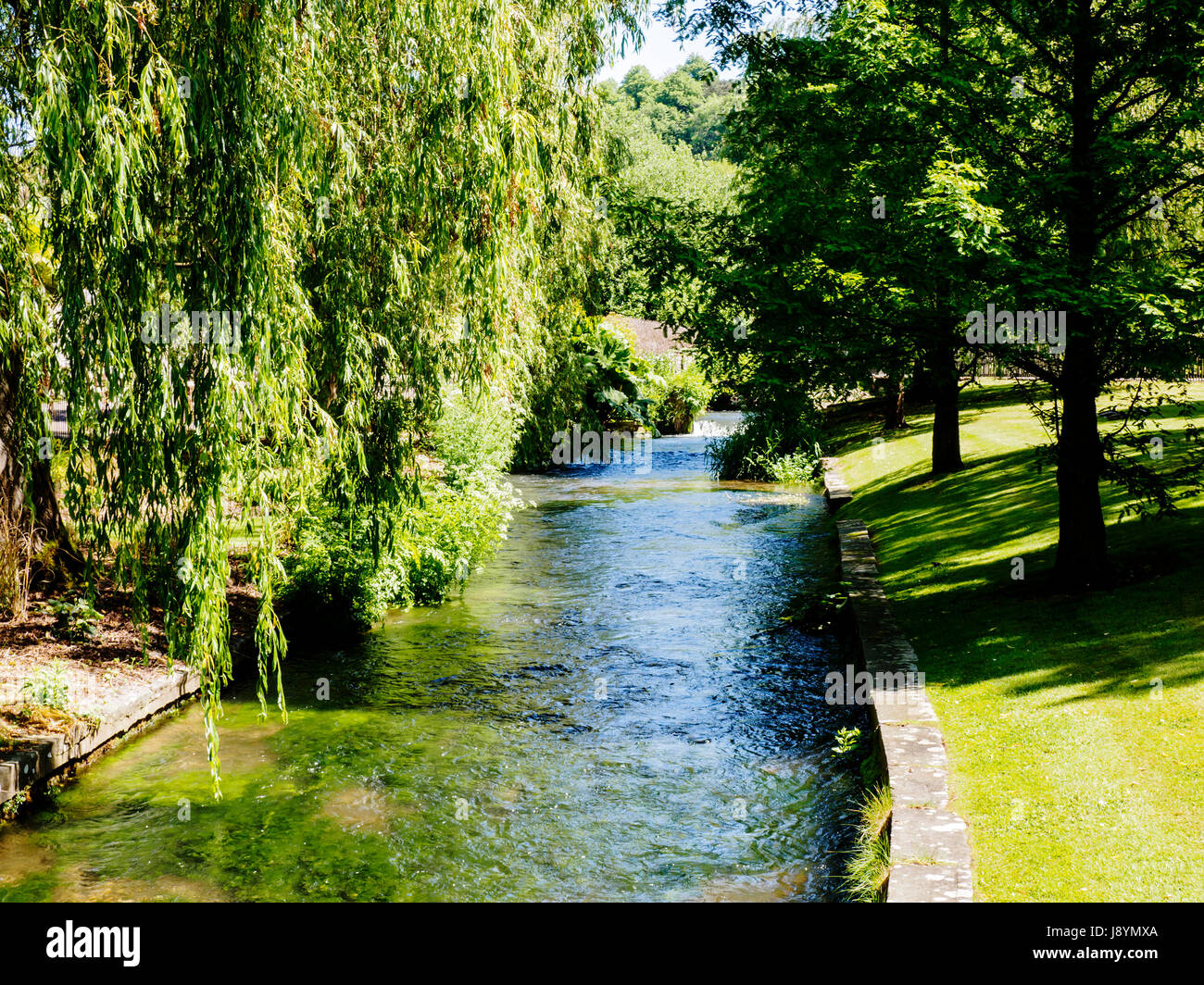 In the centre of Winchester, Hampshire the River Itchen below Town Mill ...