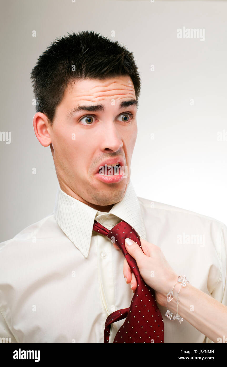 Woman dragging man by tie hi-res stock photography and images - Alamy