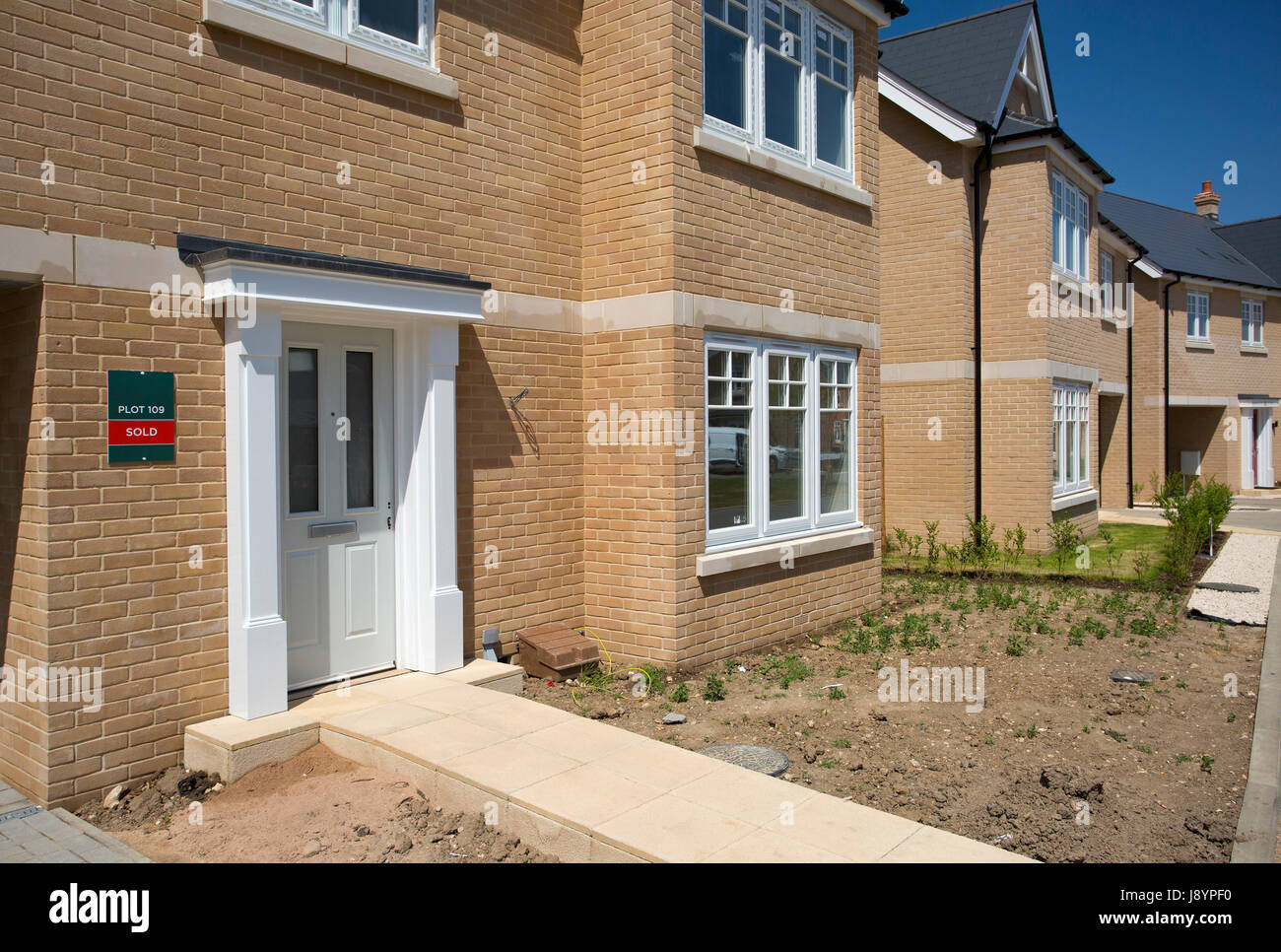 A new house in a greenfield housing development that has been sold ...