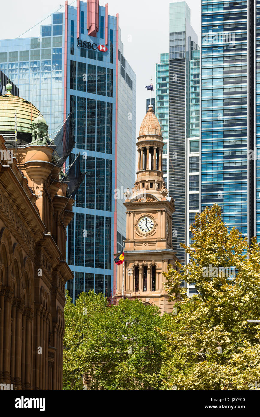 Contrasting architecture. Queen Victoria building and Town hall with ...
