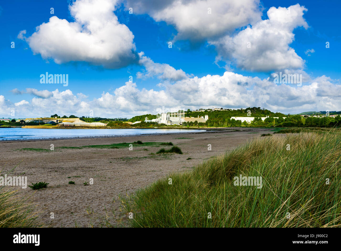 Facing West along Par Sands gives a stark contrast to the idyllic vista ...