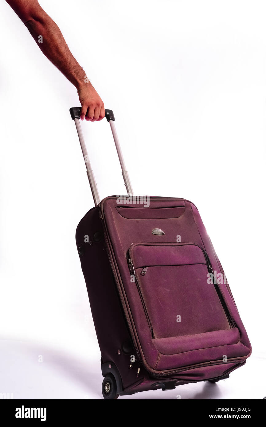 Pulling trolley bag Stock Photo - Alamy