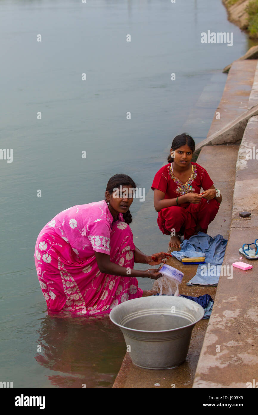 Young indian woman washing clothes at Tungabhadra Canal, Hospet ...