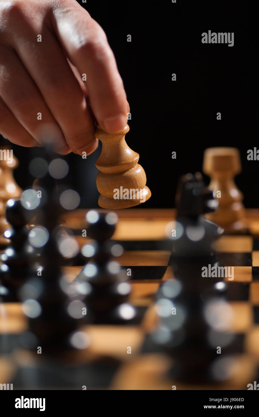 Close up image of man who is making move in chess game Stock Photo - Alamy