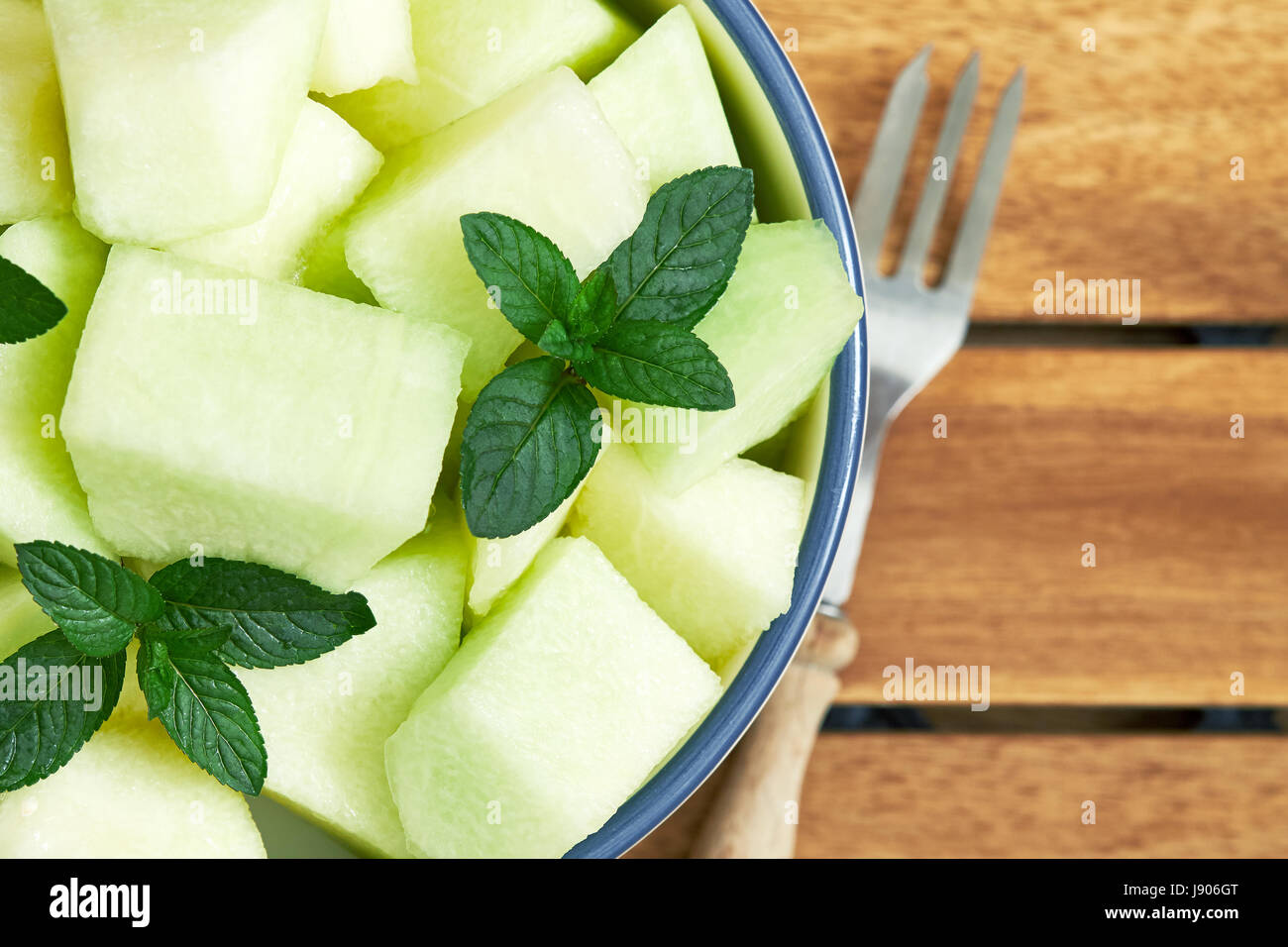 Sweet Ripe Muskmelon Galia Melon Cut And Served With Mint Leaves Top