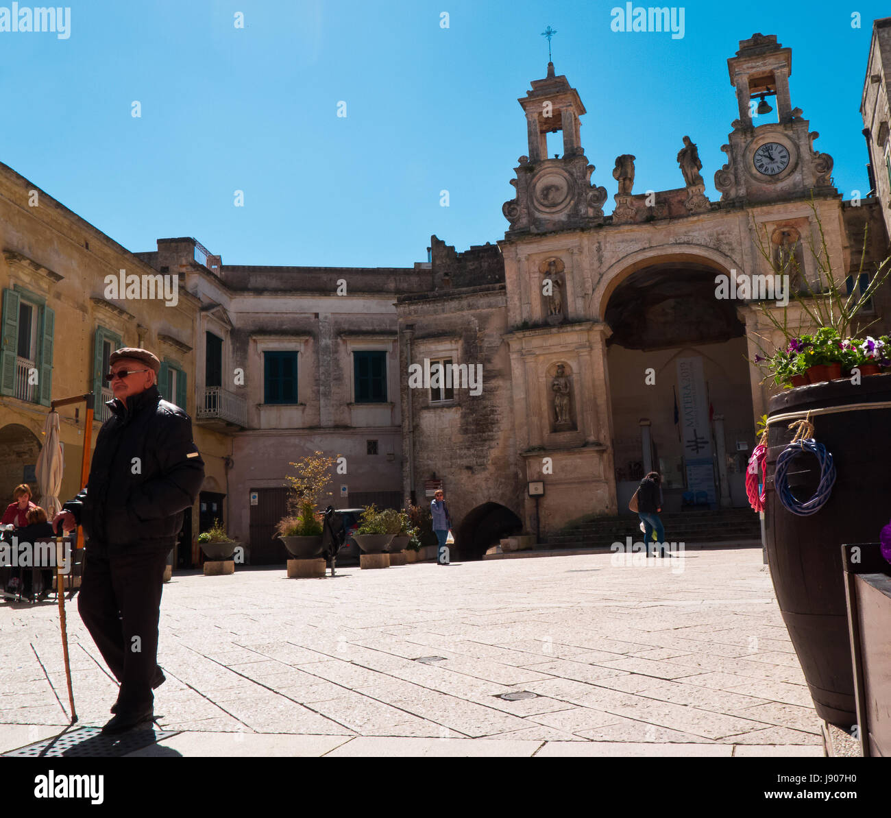 View of old square of Matera city with people around Stock Photo - Alamy