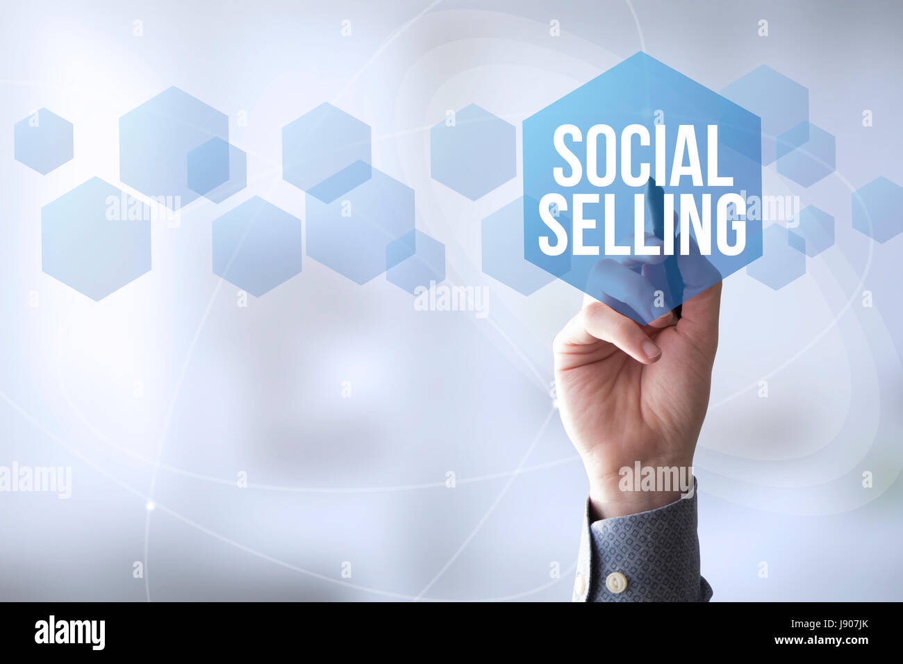 hand touching a touch screen interface with social selling Stock Photo ...