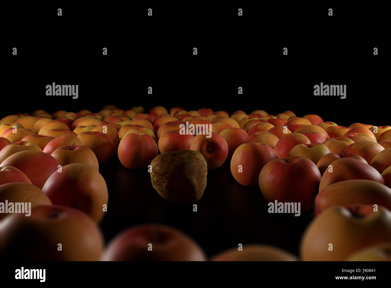 3d rendering of rotten apple in the middle of red apples in low key way ...