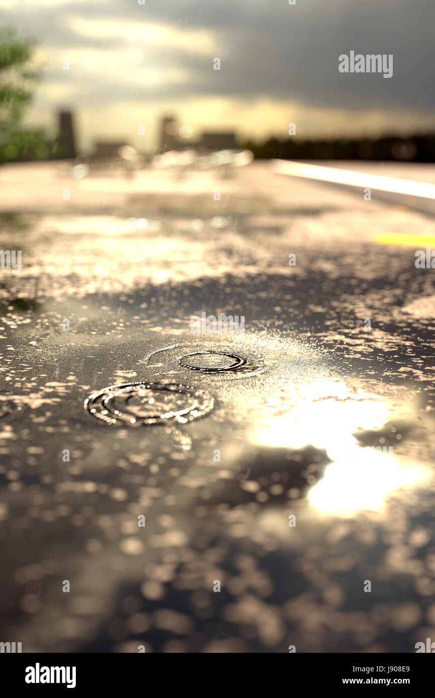 Raindrops in puddle hi-res stock photography and images - Alamy