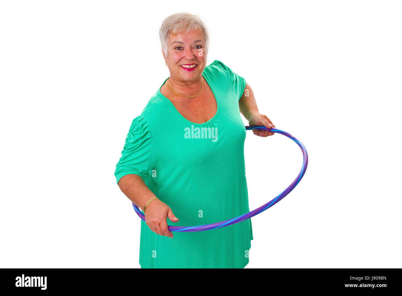 Senior lady doing gymnastic with hula hoop - isolated on white ...