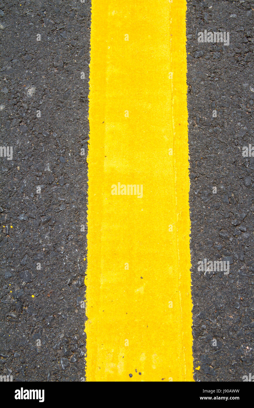 Yellow line on the road Stock Photo - Alamy