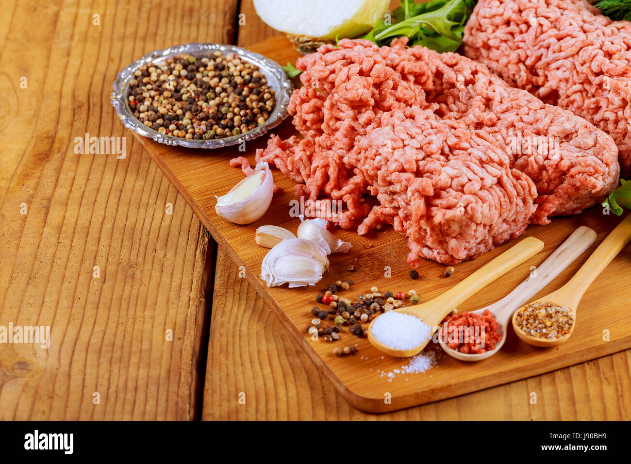 Grass Fed Organic Raw ground beef with spices Stock Photo - Alamy