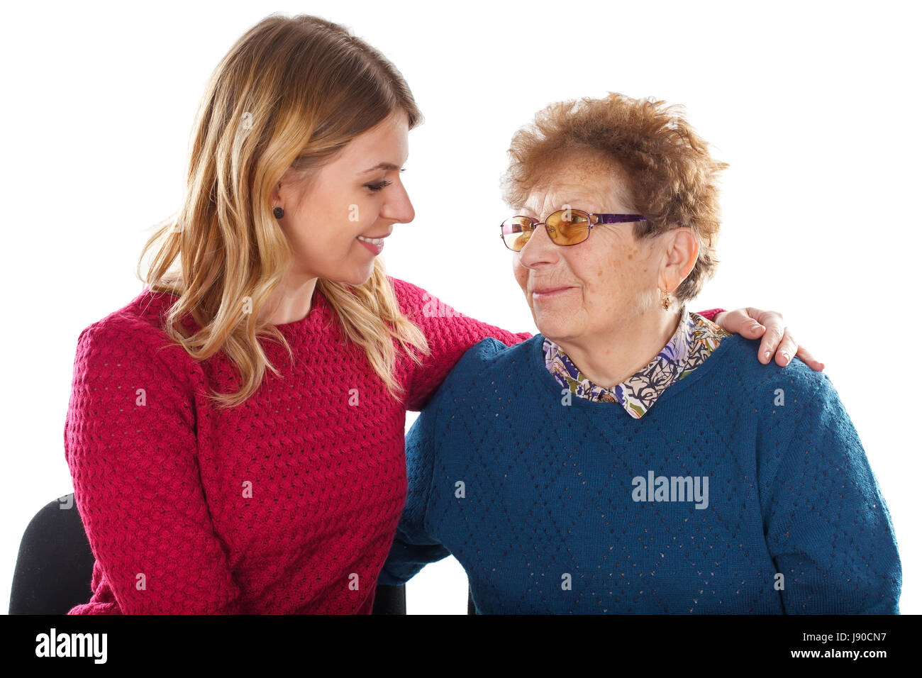 Picture of a kind woman helping an old lady - isolated background Stock ...