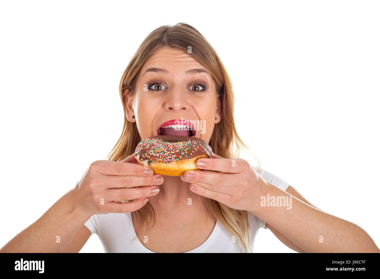 Picture of a young woman eating a delicious doughnut Stock Photo - Alamy