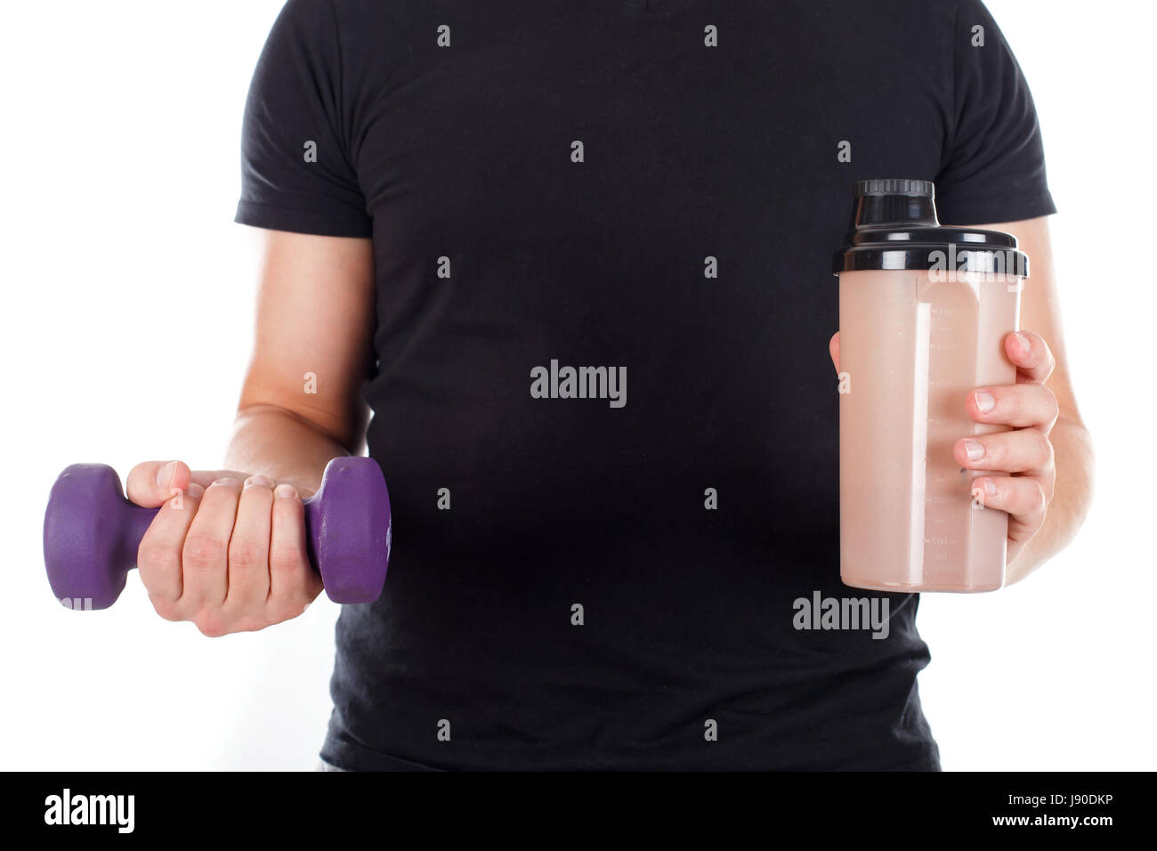 Close up picture of a young man holding a dumbbell and a shake Stock ...