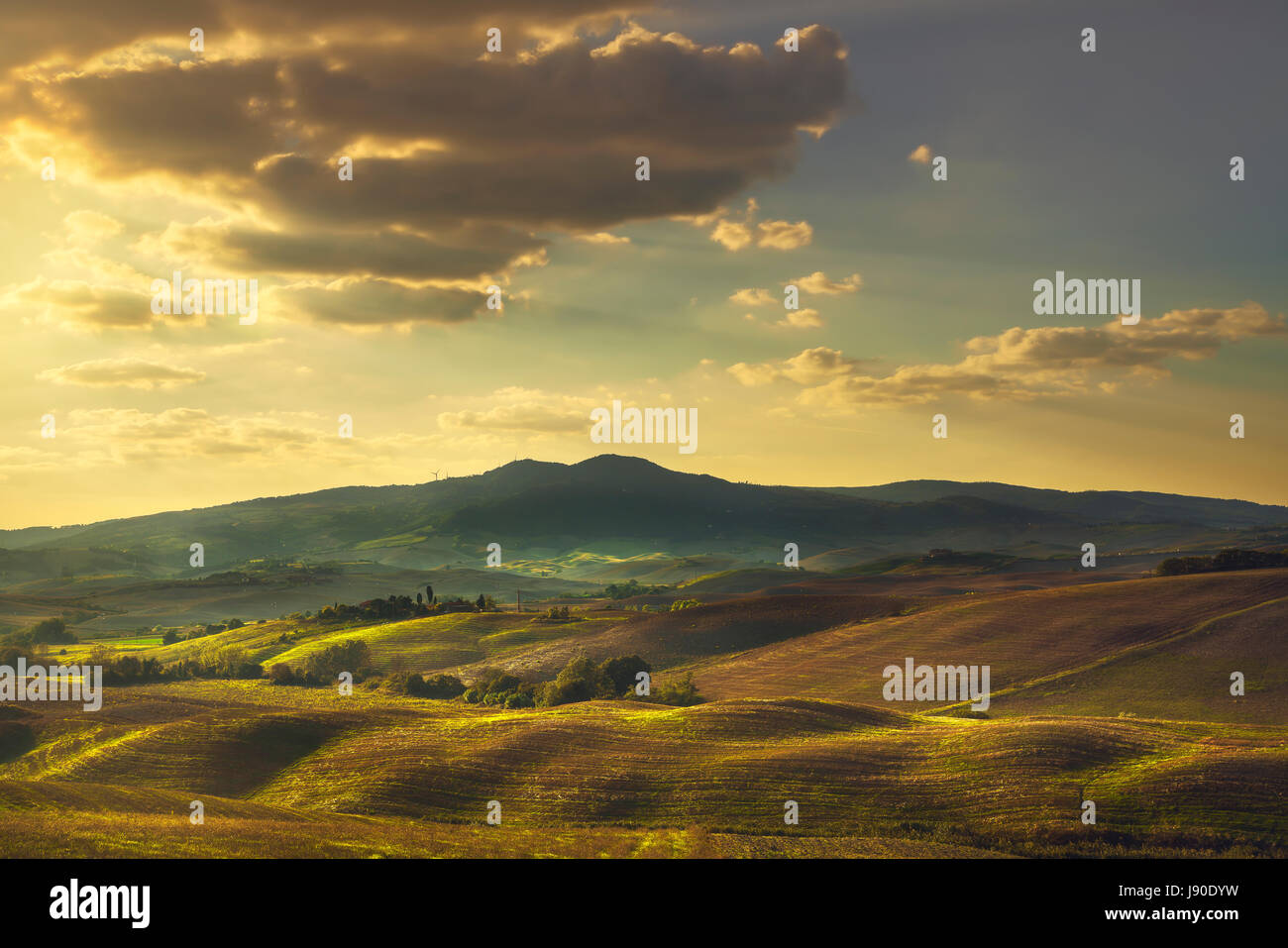 Volterra, rolling hills on sunset. Rural landscape. Green fields and ...