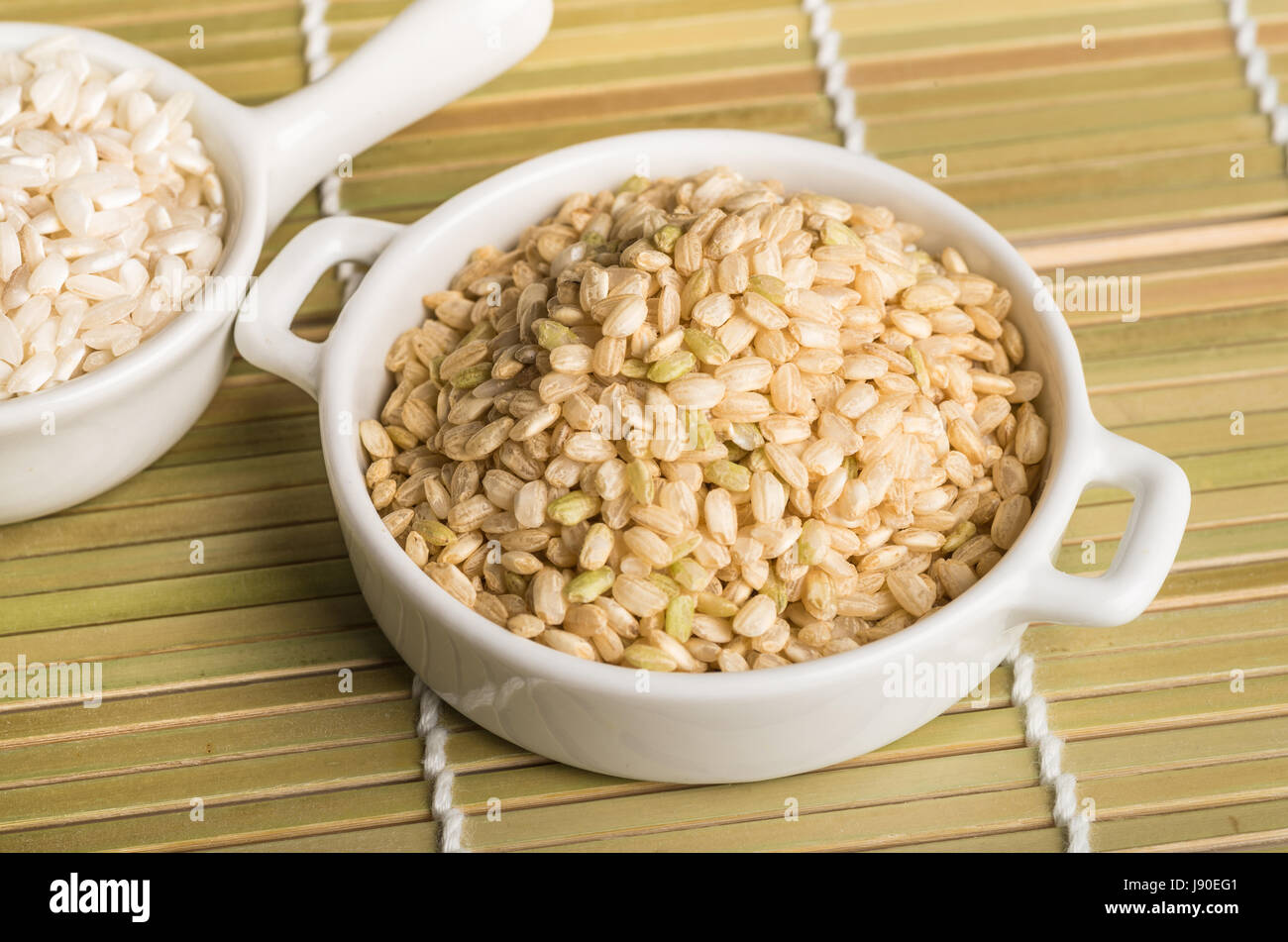 Whole and long grain white rice Stock Photo - Alamy