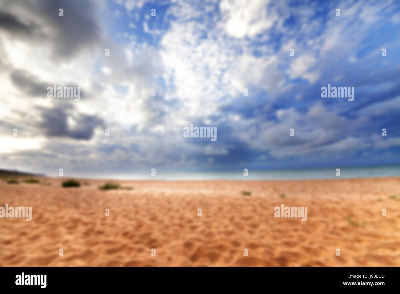 Blurred sea beach in sun summer day. Use as background Stock Photo - Alamy
