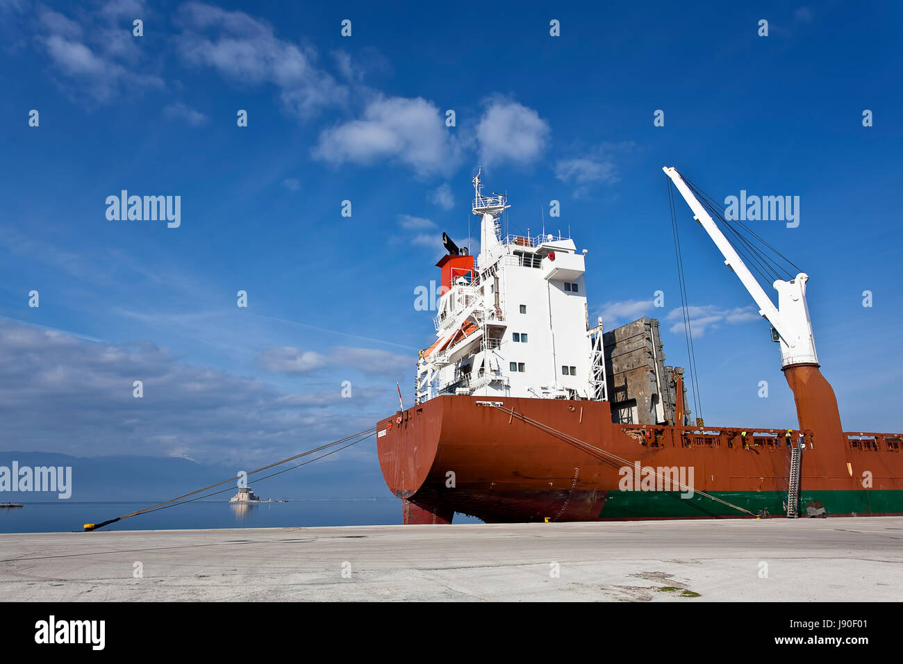 Large container ship in mediterranean coast Stock Photo - Alamy