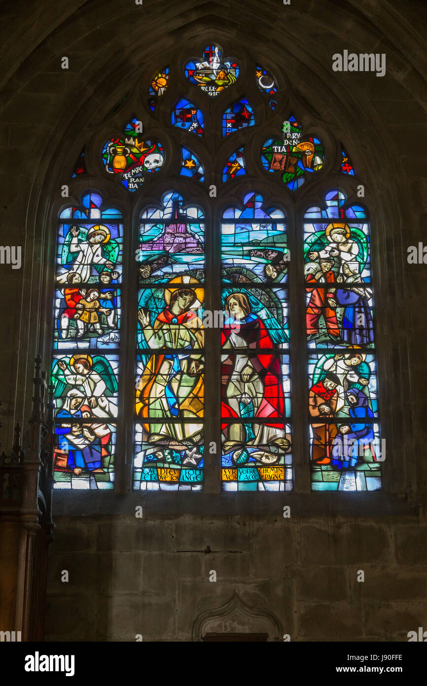 Modern stained glass windows that depict the saints of the Catholic ...