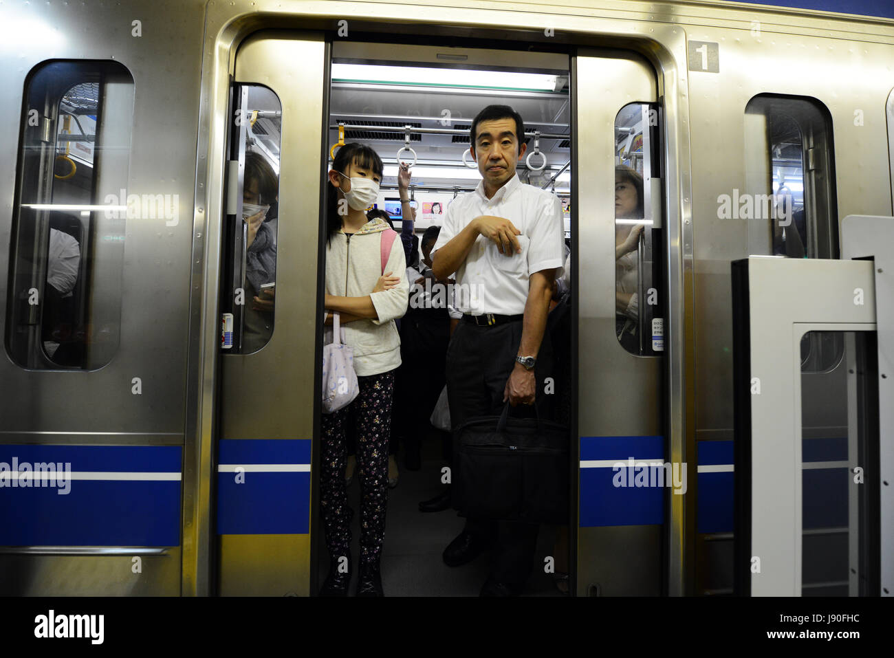 Passengers on Tokyo's metro & JR lines Stock Photo - Alamy