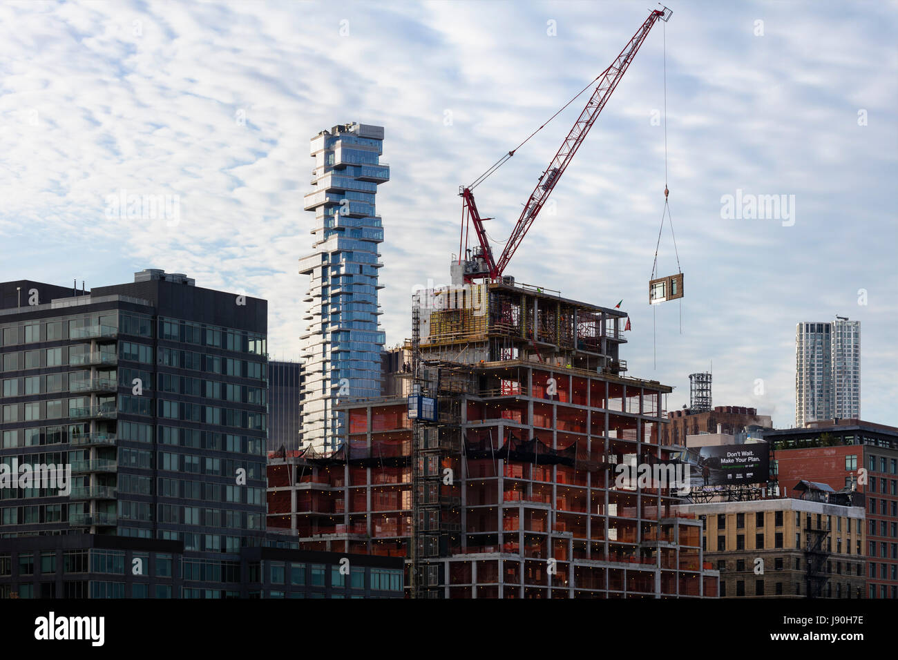 Contextual exterior view with a neighbouring building under ...