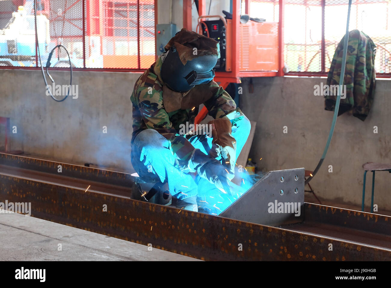 Man welding steel by skill.Men wear protective clothing during work ...