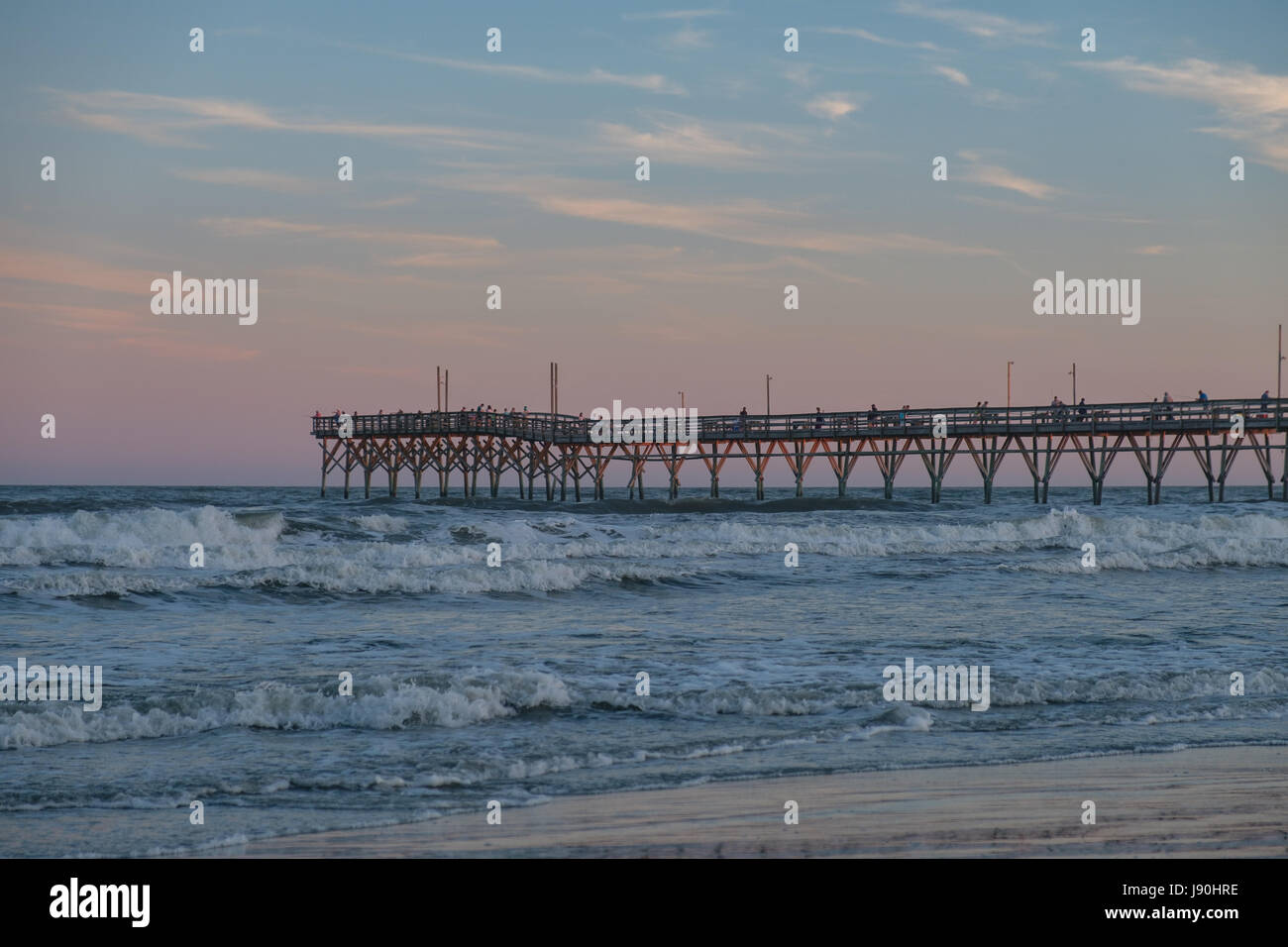 Quiet beach pier sunset hi-res stock photography and images - Alamy