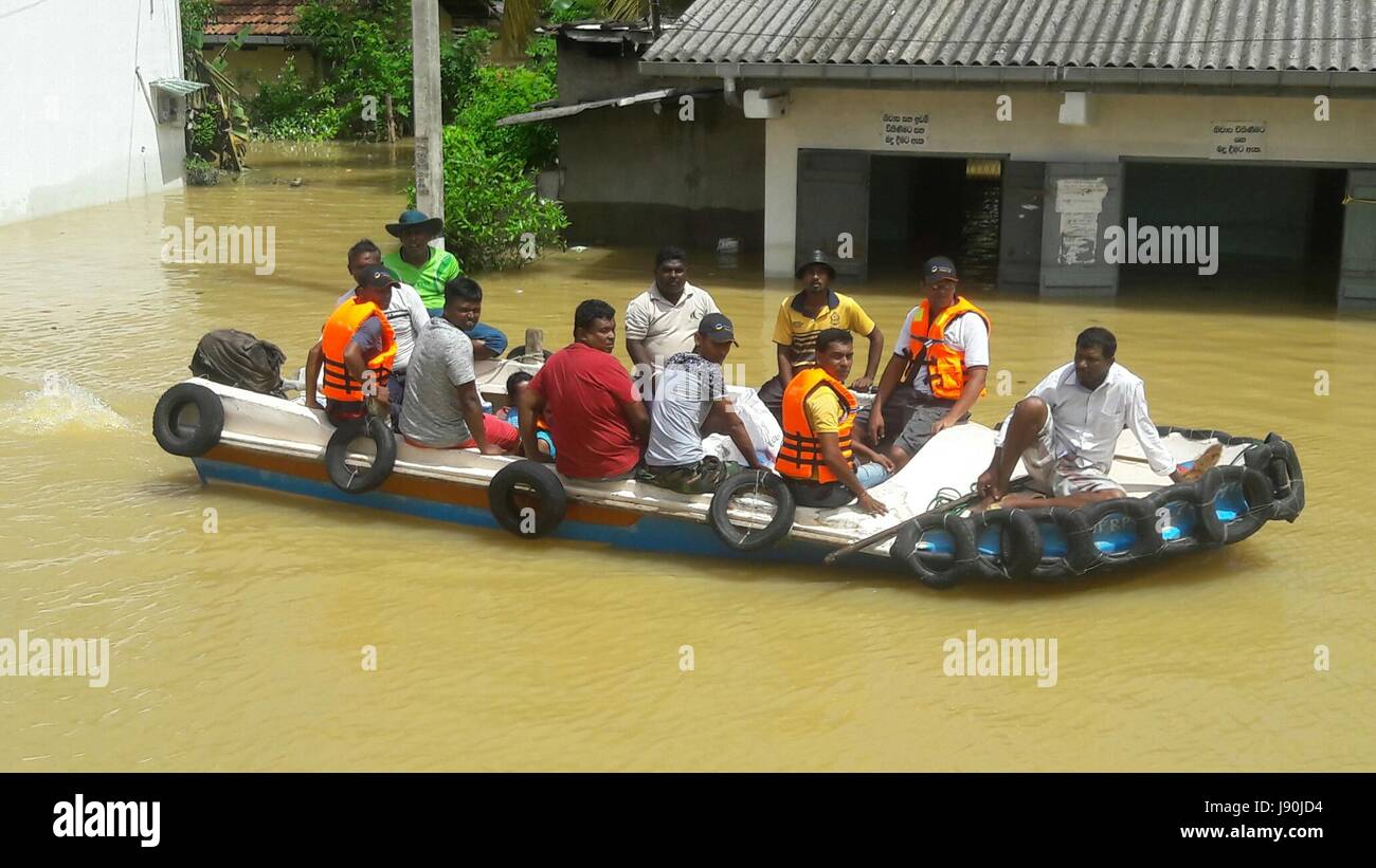 Colombo. 30th May, 2017. People evacuate from a flood-affected area in ...