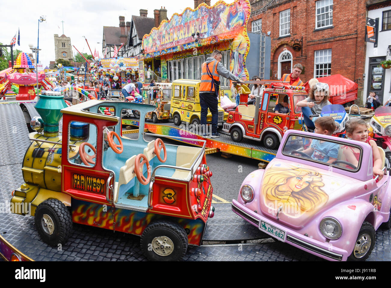 London, UK. 31 May 2017. Young children on a car ride. Thousands of ...