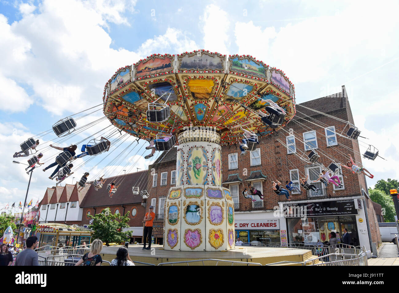 London, UK. 31 May 2017. Customers fly overhead on a spinning ride ...