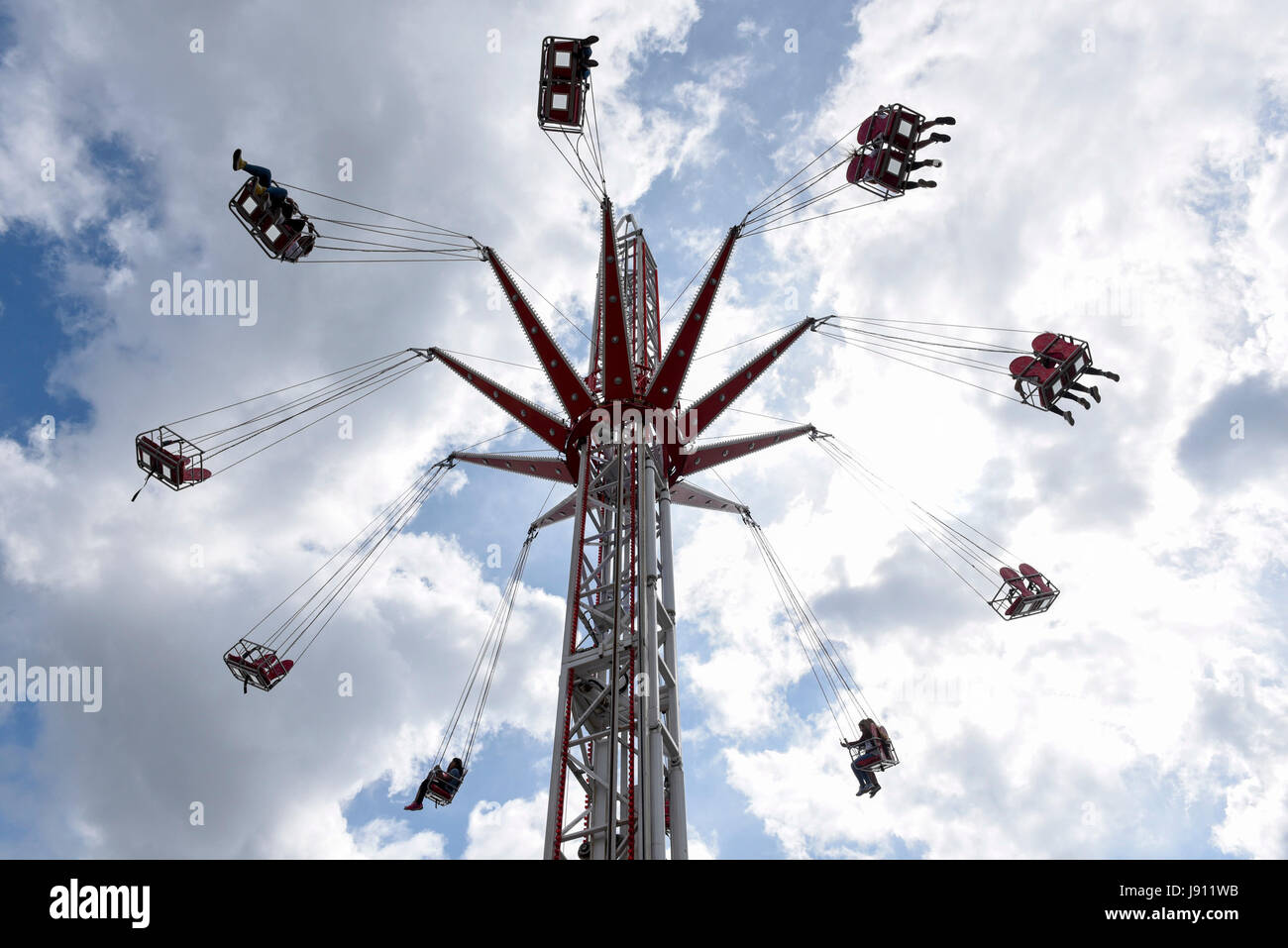 London, UK. 31 May 2017. Customers fly overhead on a spinning ride ...