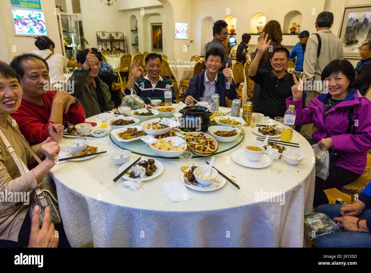 Guilin, China. Chinese Friends at Dinner in a Restaurant Stock Photo ...