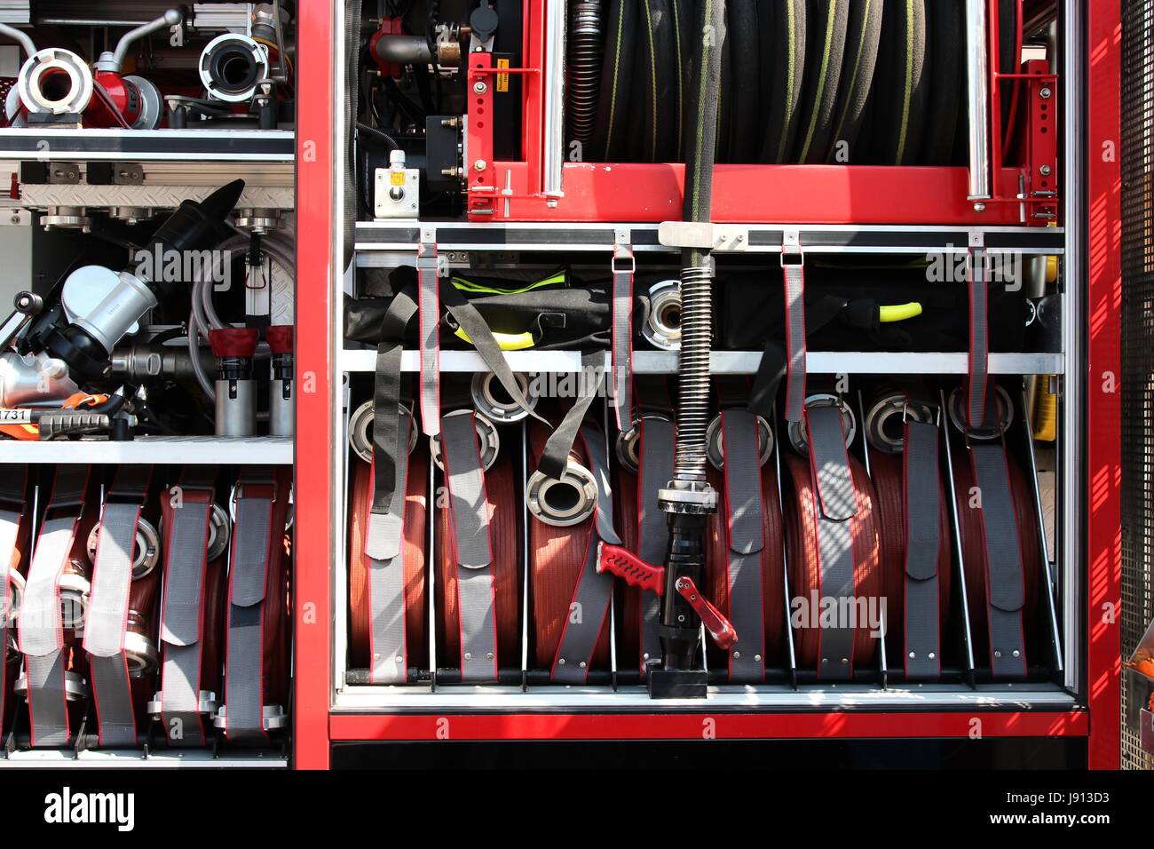 fire hoses on board a fire engine Stock Photo - Alamy